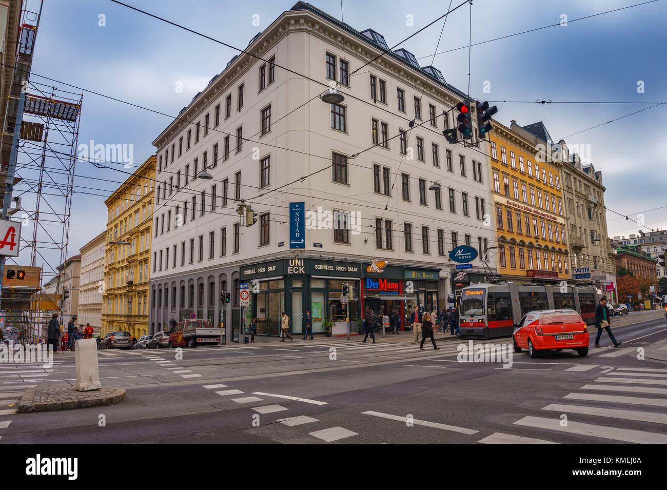 Architectural buildings and street traffic in a typical day in Vienna ...