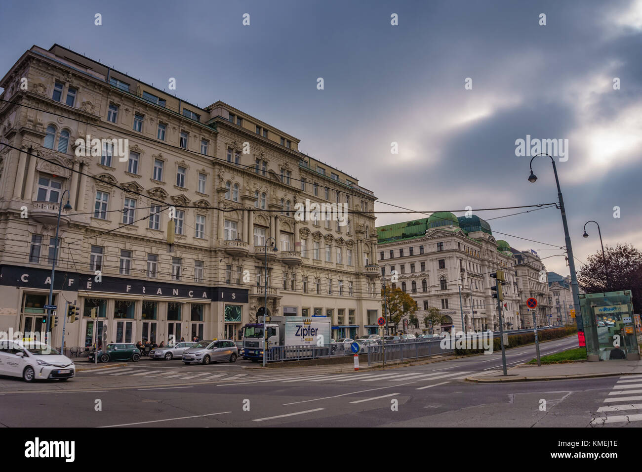 Architectural buildings and street traffic in a typical day in Vienna ...