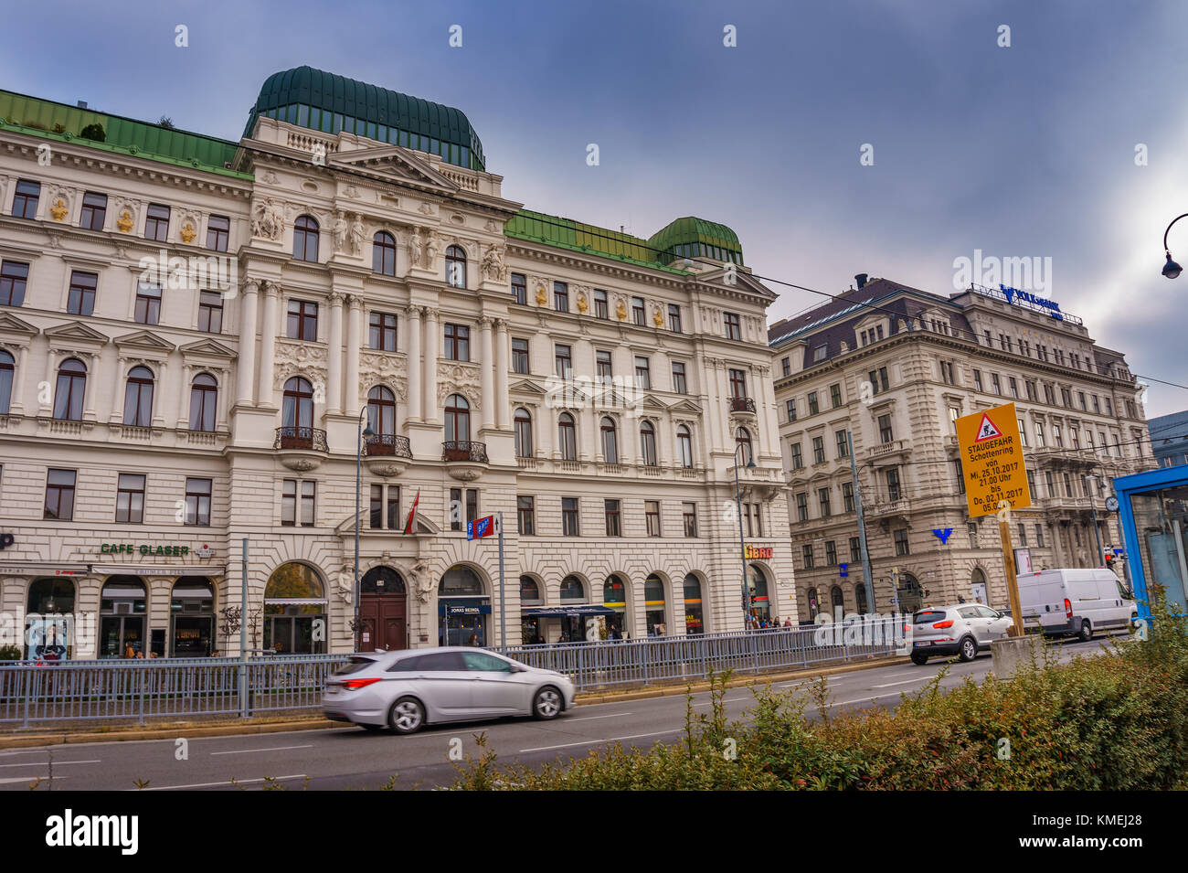 Architectural buildings and street traffic in a typical day in Vienna ...