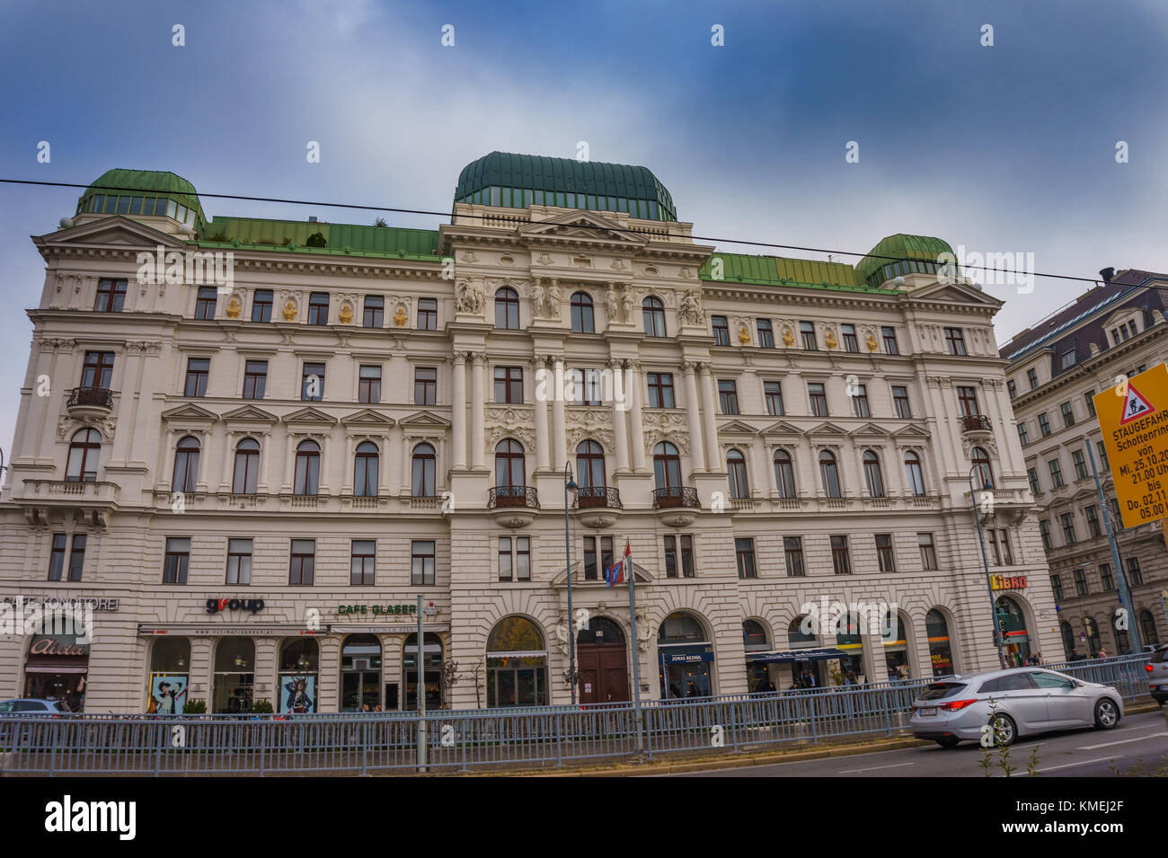 Architectural buildings and street traffic in a typical day in Vienna ...