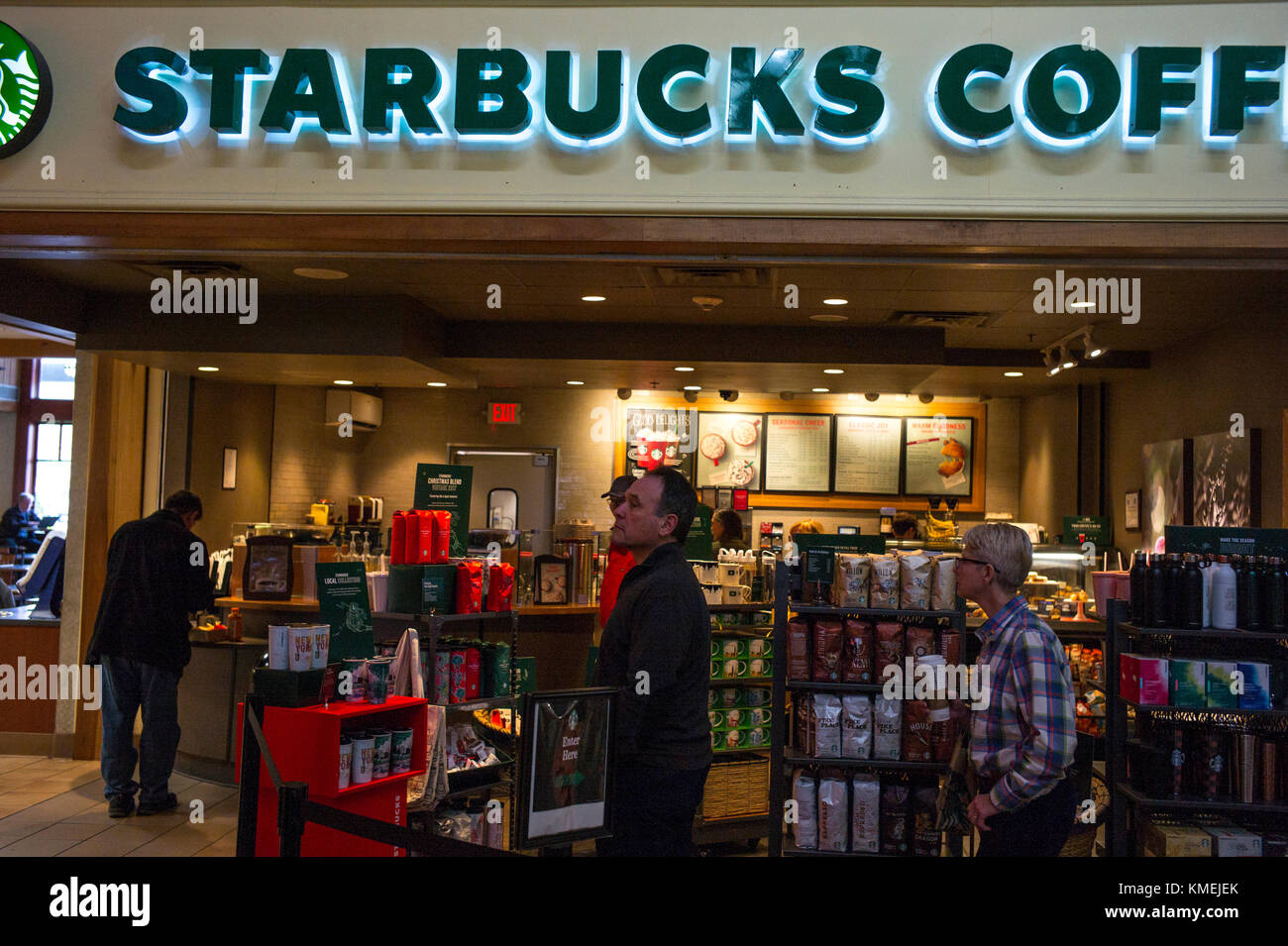 Customers stand in line at a Starbucks Coffee Shop inside the New ...