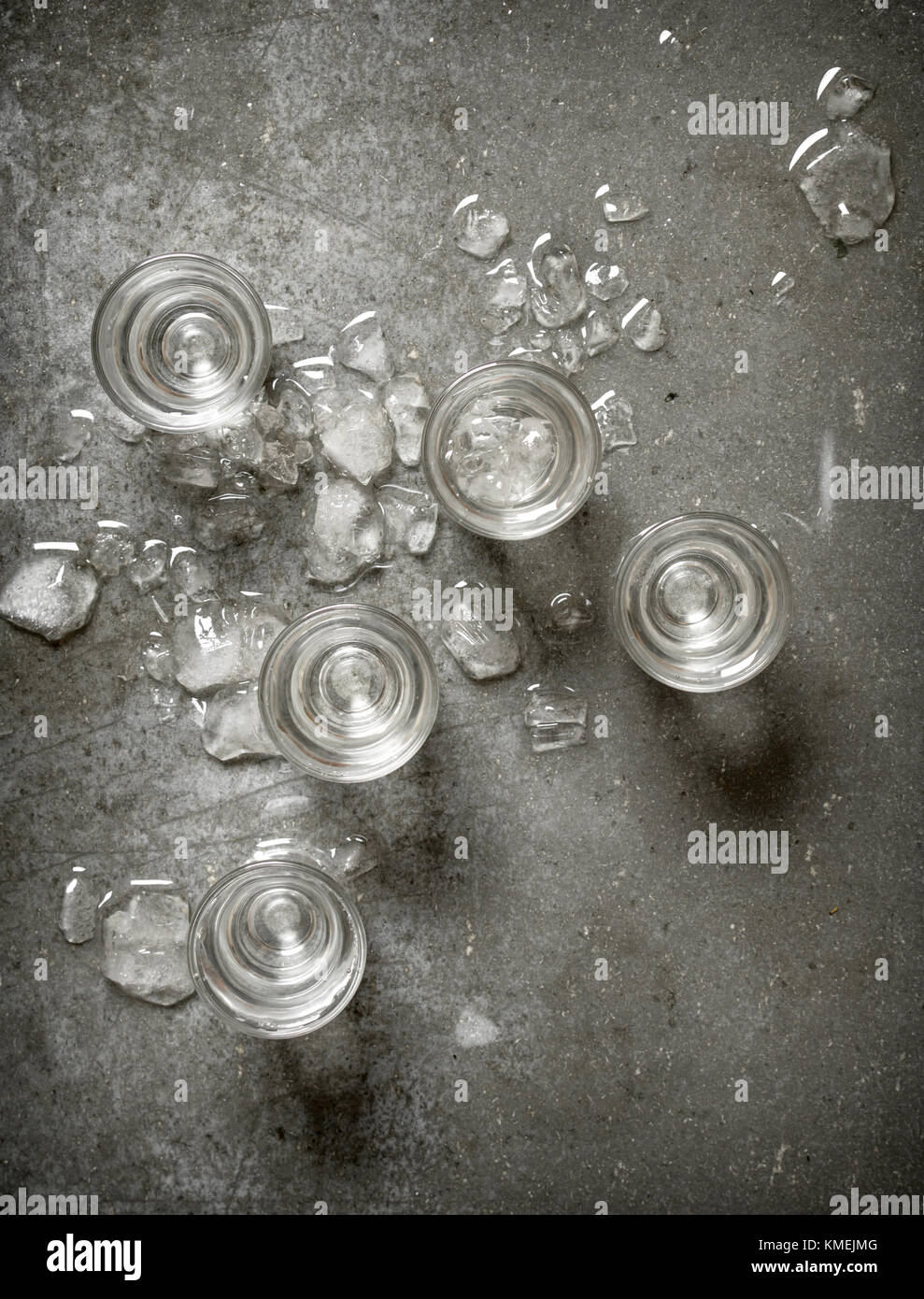 The vodka glass with ice. On the stone table Stock Photo - Alamy