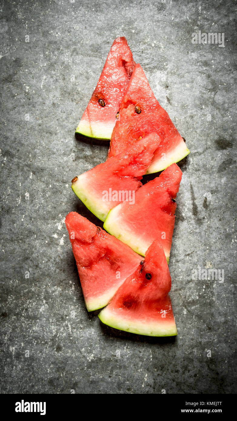 pieces of watermelon. On the stone table Stock Photo - Alamy