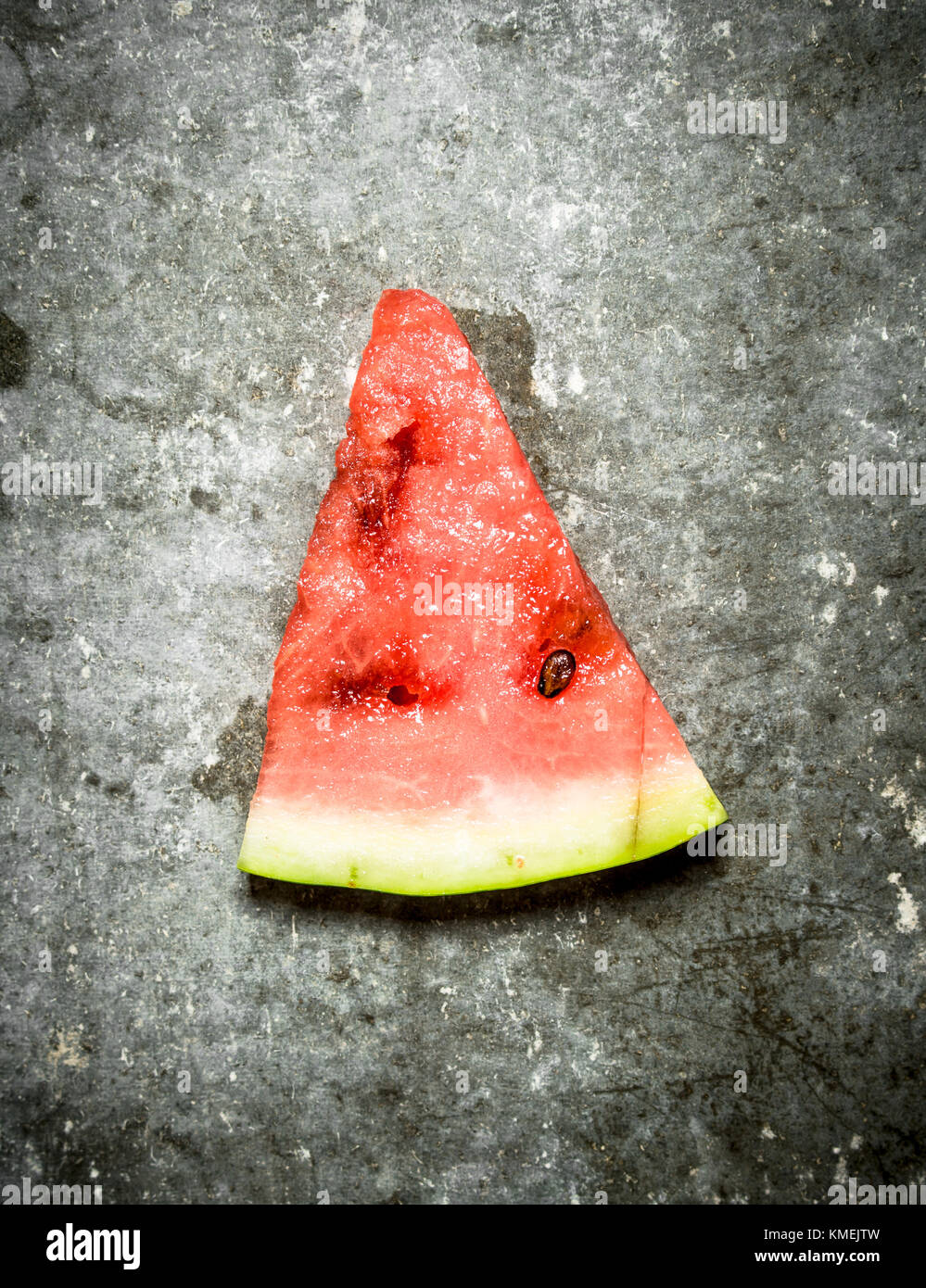 piece of watermelon. On the stone table Stock Photo - Alamy