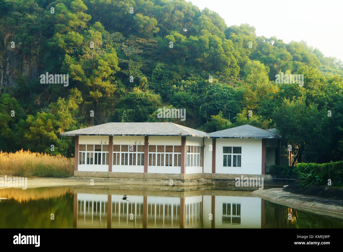 The landscape of the building at the side of the reservoir Stock Photo ...