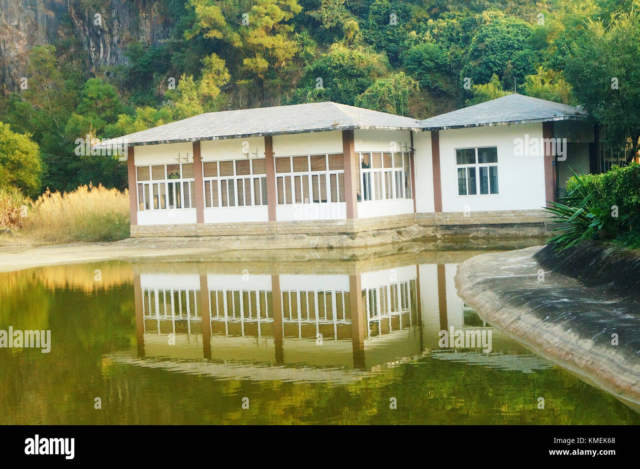 The landscape of the building at the side of the reservoir Stock Photo ...