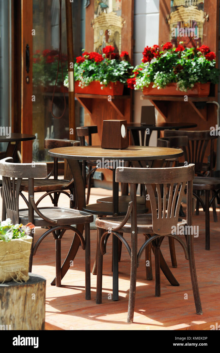 Table and chairs on the terrace of the restaurant Stock Photo - Alamy