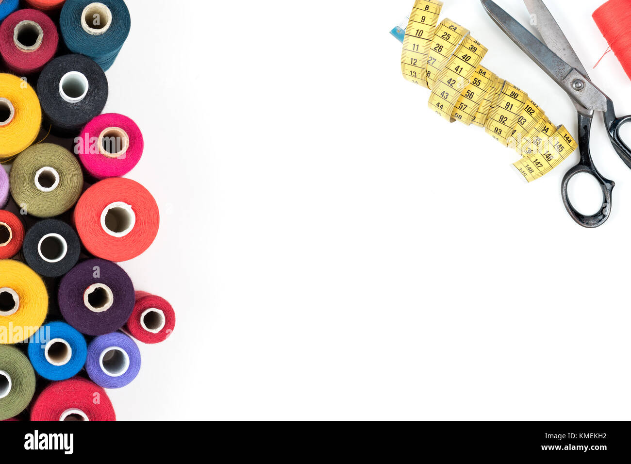 Colored threads on a white background, sewing supplies, text ready ...