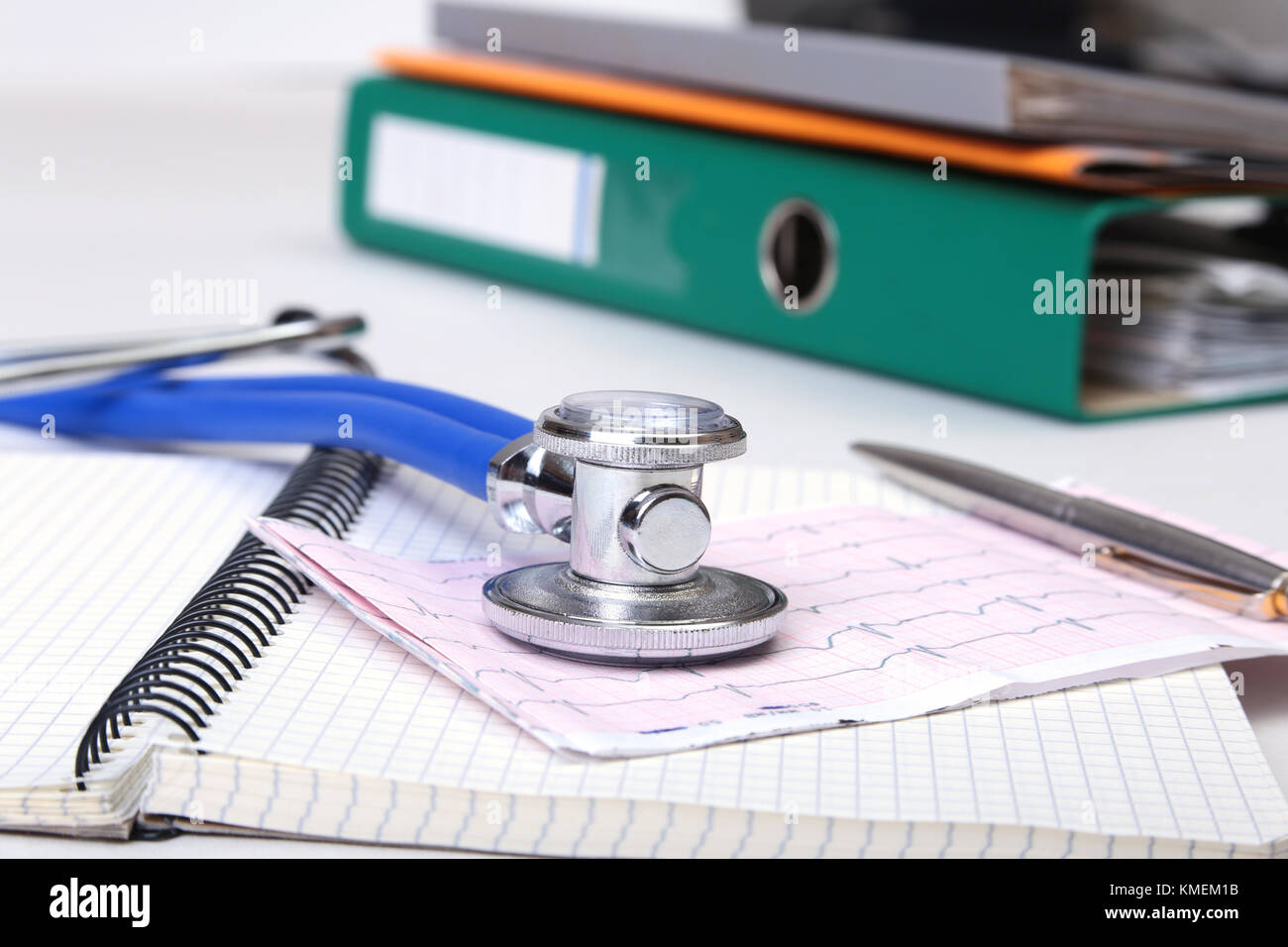 Folder file, stethoscope and RX prescription on the desk. blurred ...