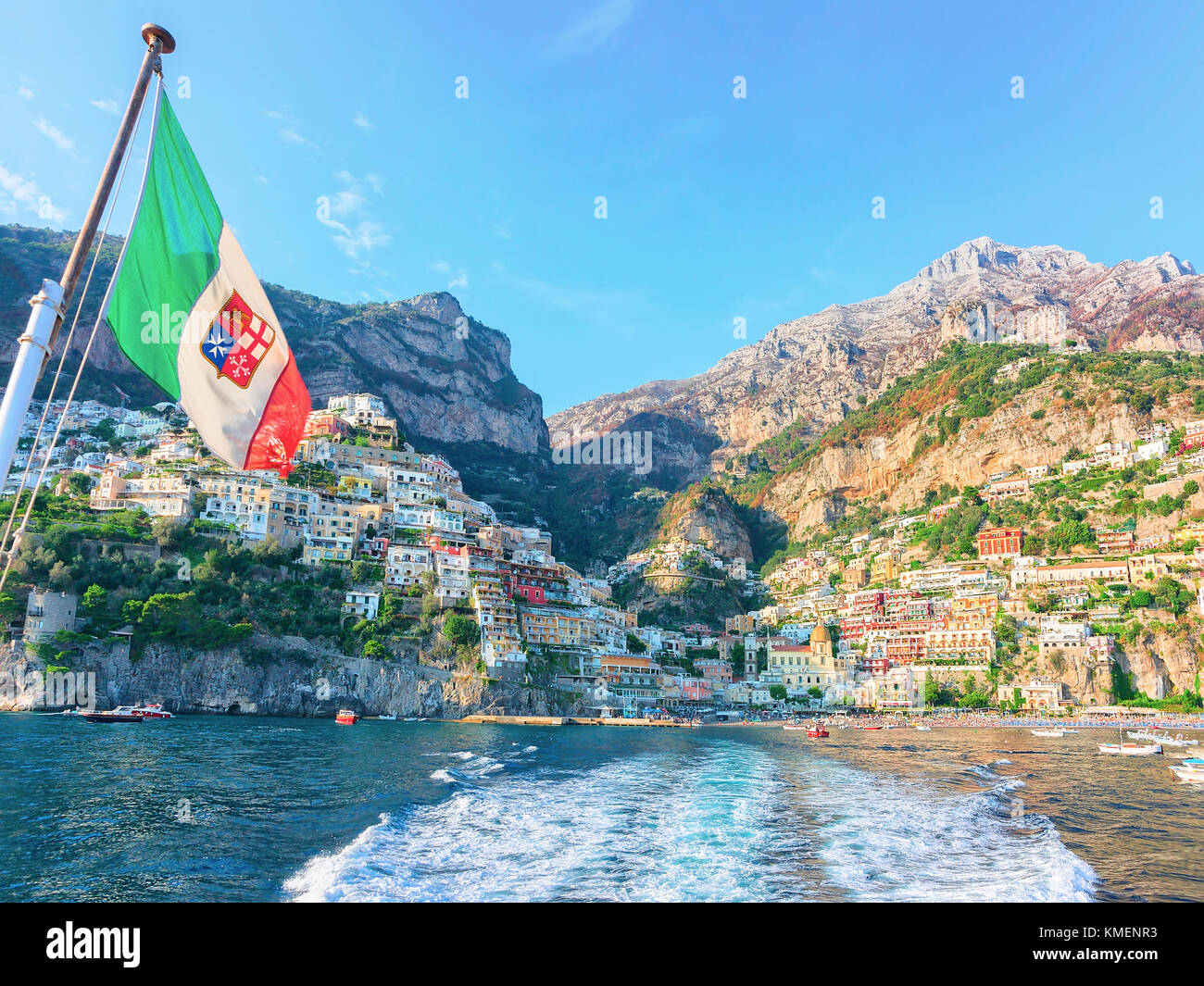 Italian flag with Positano town at Tyrrhenian sea, Amalfi coast, Italy ...
