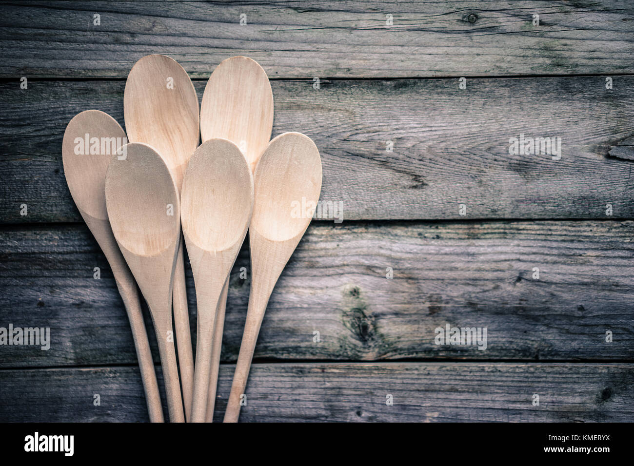 Wooden spoons on rustic background Stock Photo - Alamy