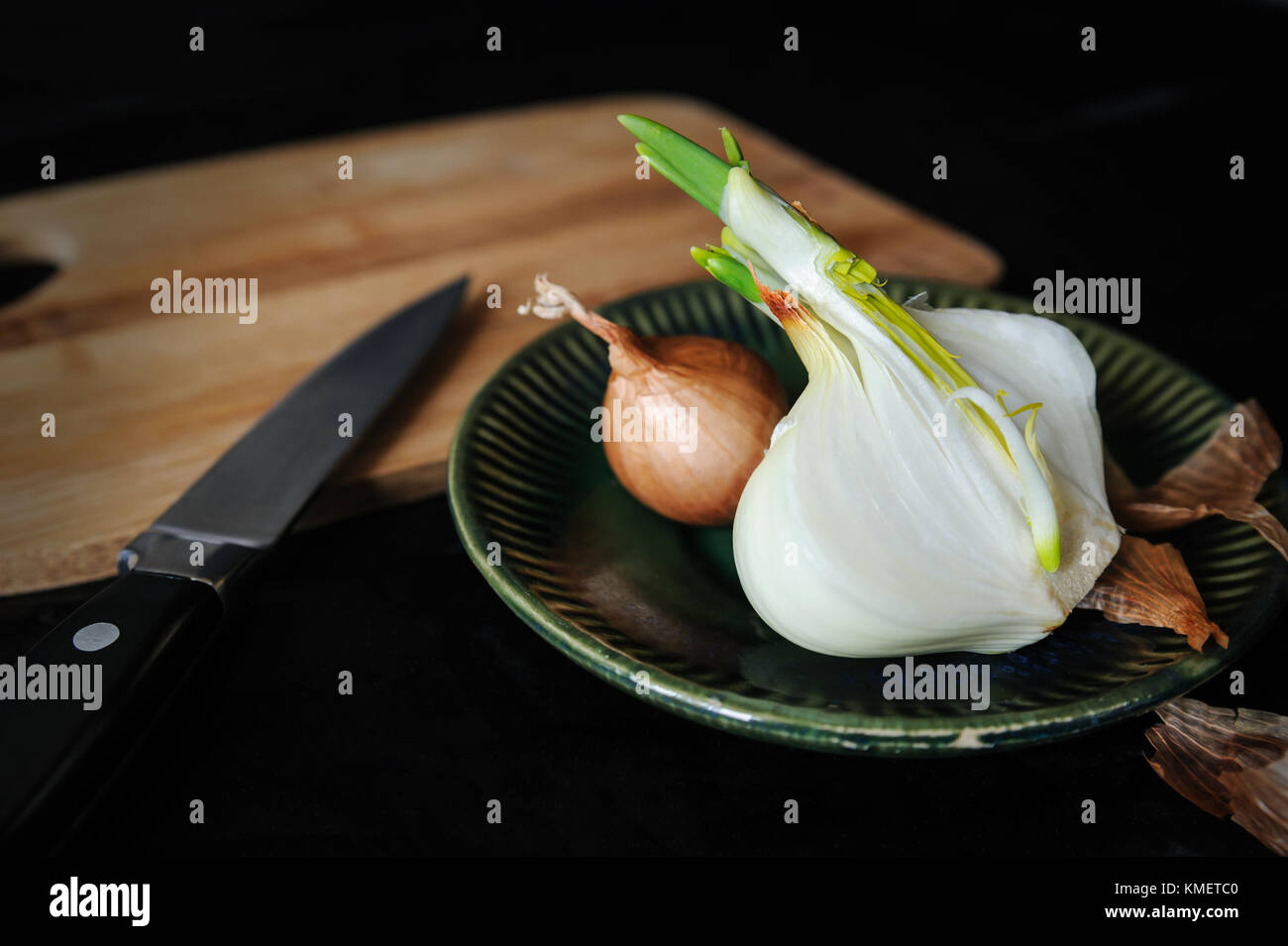 Cutting green onions on black hi-res stock photography and images - Alamy