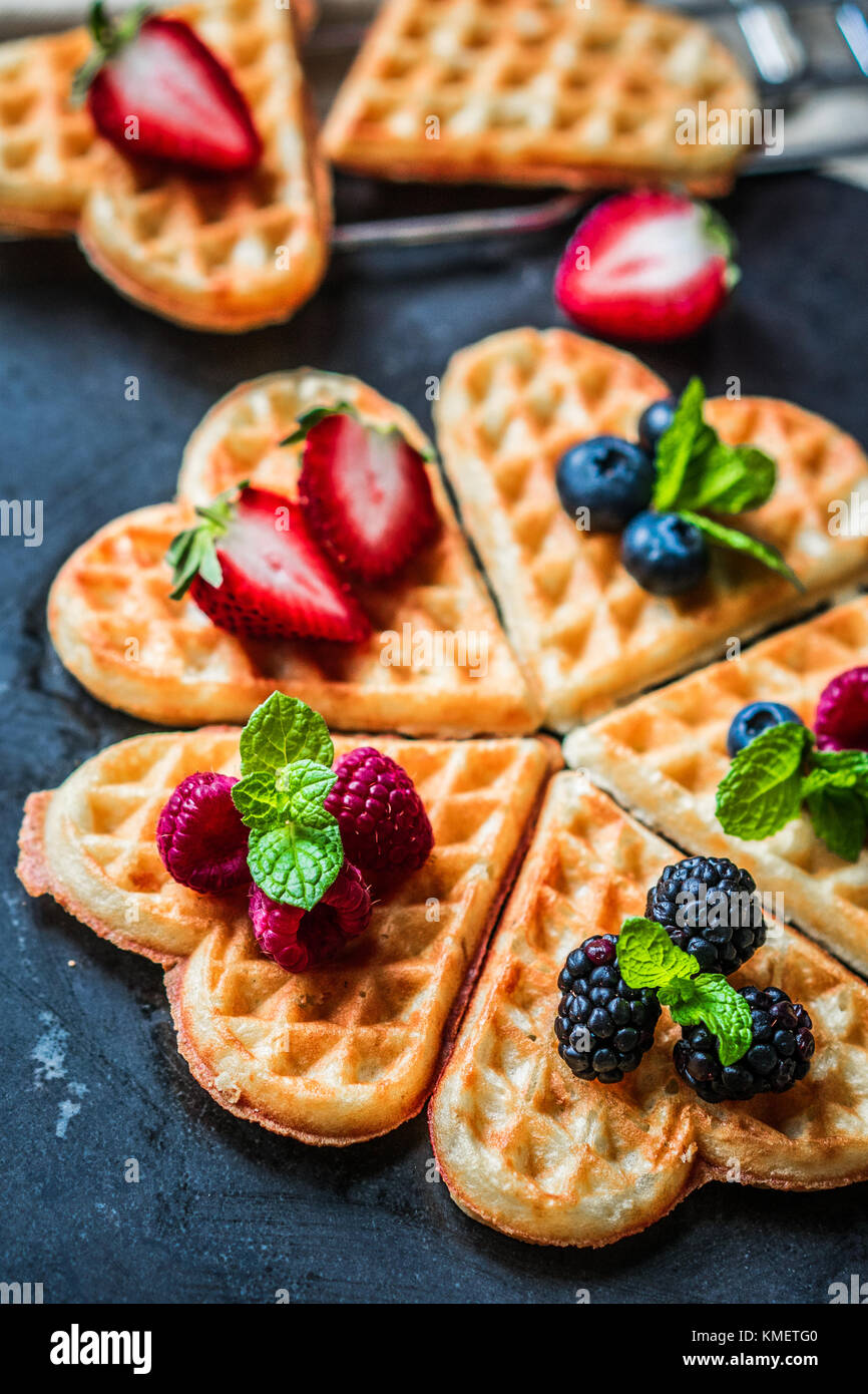 Heart waffles with berries Stock Photo - Alamy