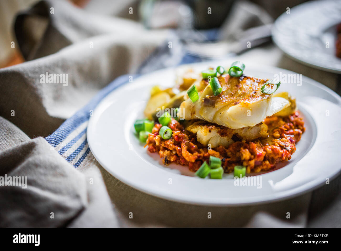 Roasted Hake With Romesco Sauce And Onion On Wooden Background Stock ...
