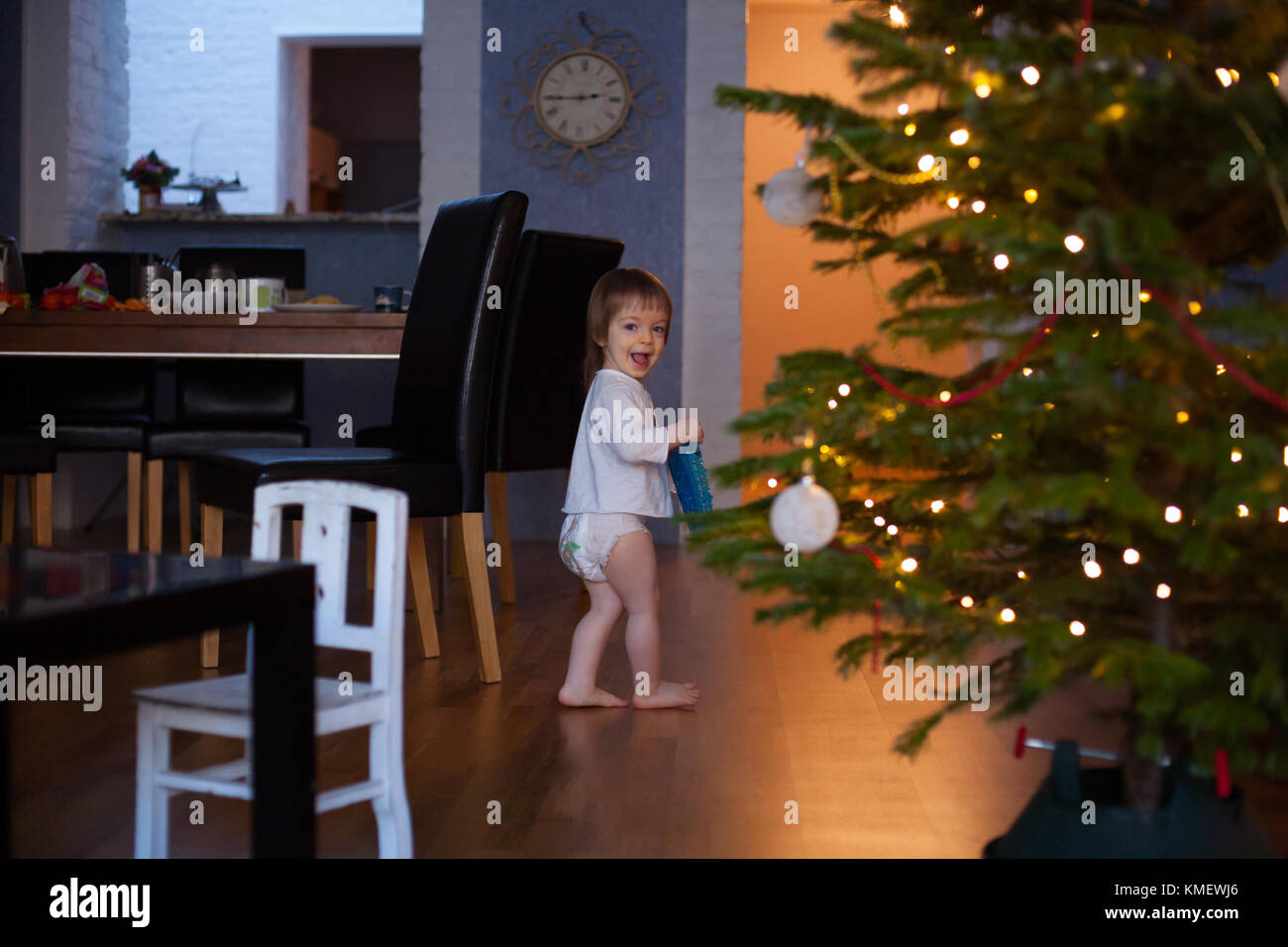 Funny little smiling kid boy holding christmas tree Stock Photo - Alamy