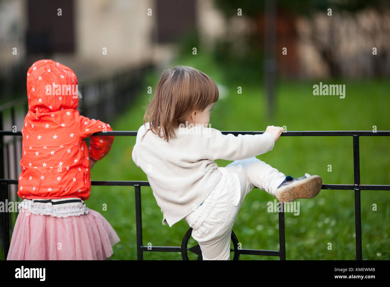 Boy leaning over fence High Resolution Stock Photography and Images - Alamy