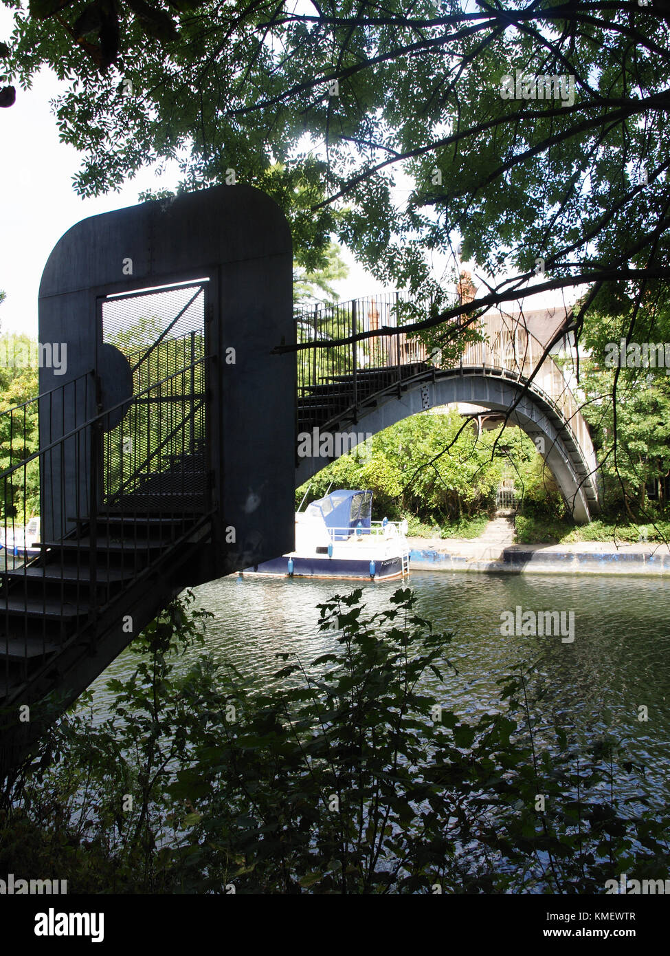 Bridge over river to Eyot House located on D'Oyly Carte Island on bank ...