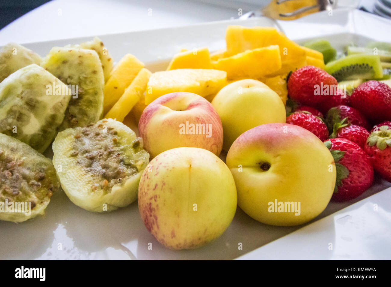 Fresh fruit range with peach, kiwi, pineapple, strawberries, ficodindia ...