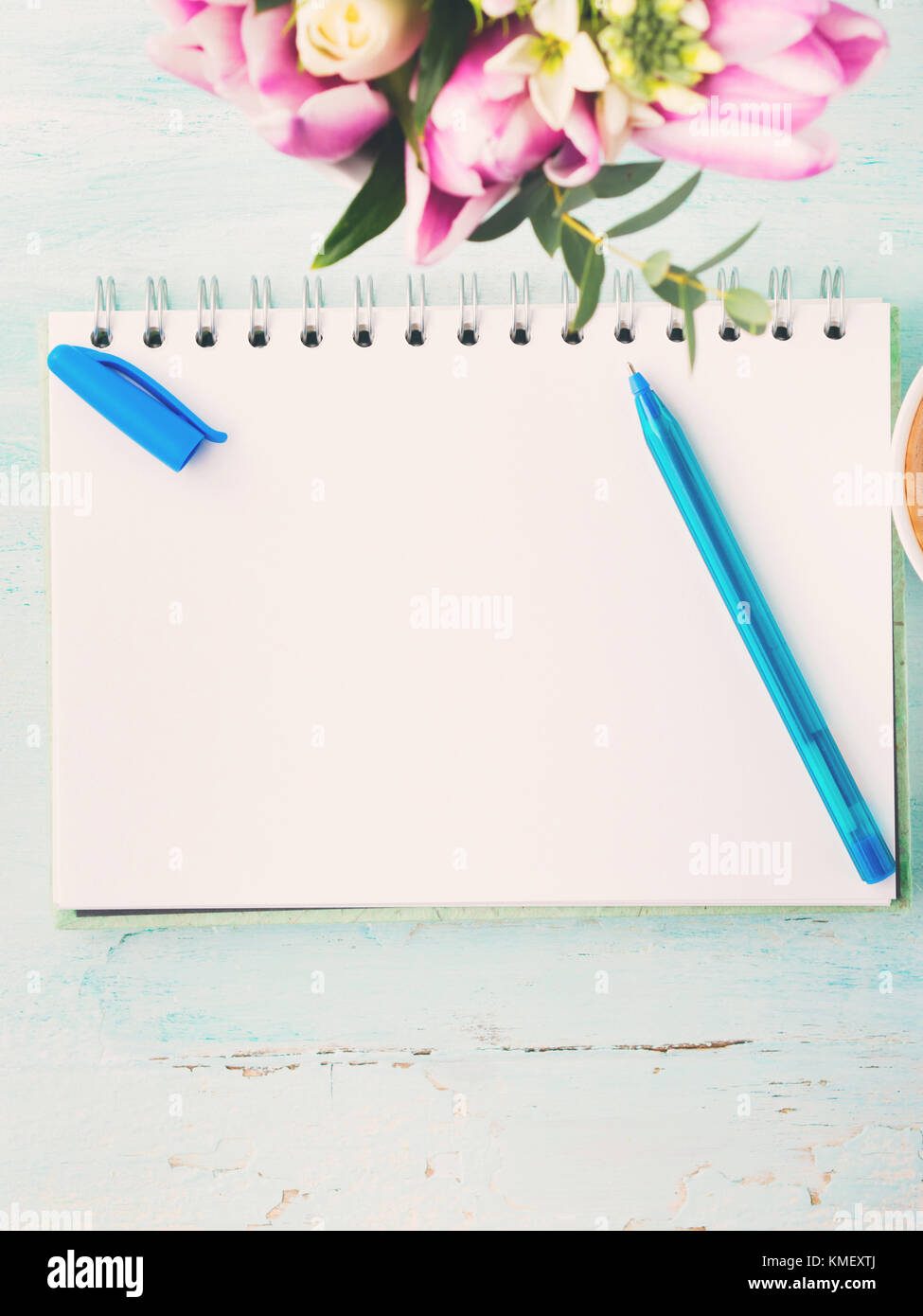 Blank empty notebook page with blue pen. Spring summer flat lay with ...