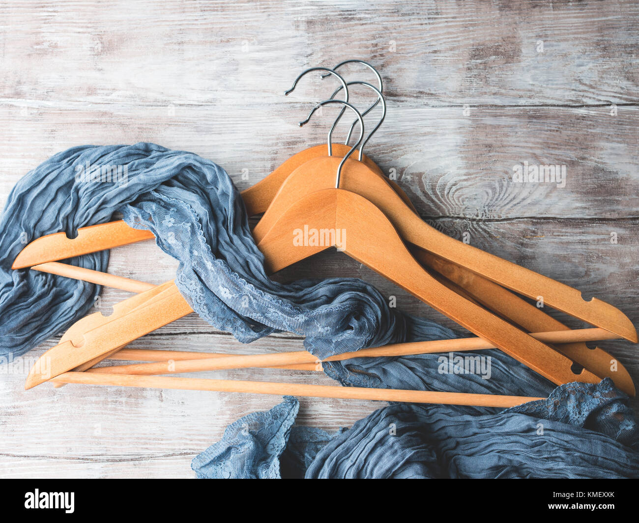 Wooden clothes hangers on bright background. What nothing to wear ...