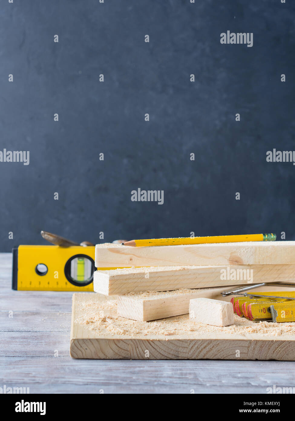 Wooden board with tools for manual measuring cutting - meter, level ...