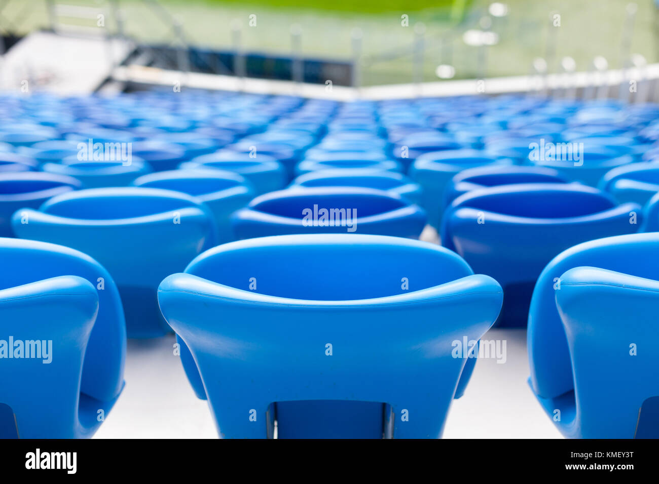 Rows of blue seats at football stadium. Convenient sitting for all ...