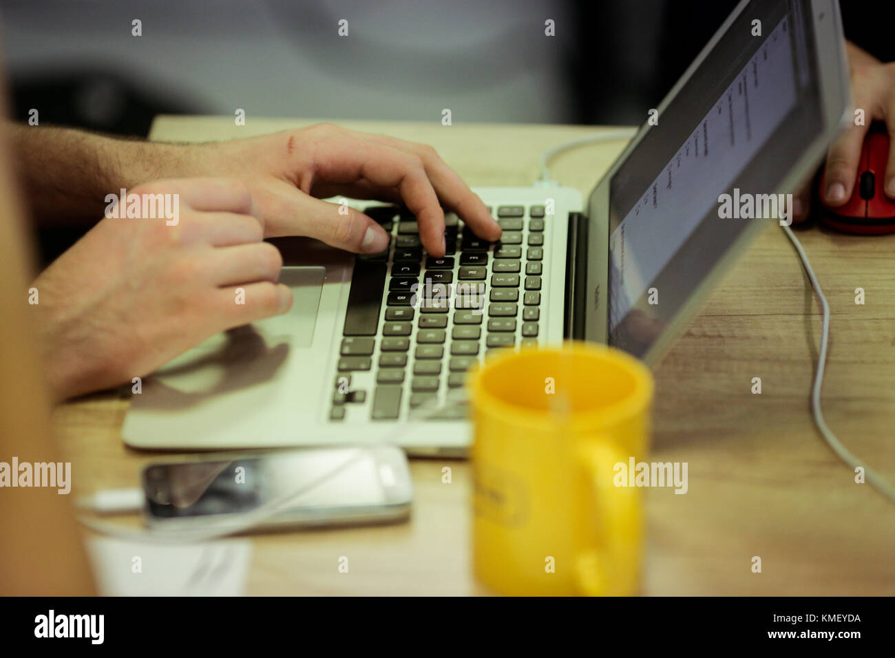 Man uses laptop for coding software Stock Photo - Alamy