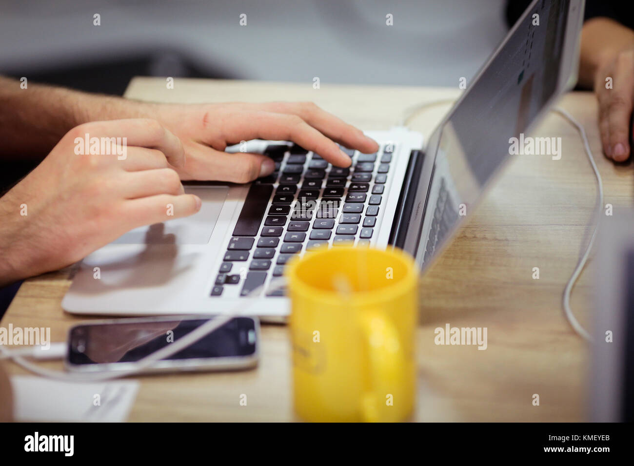 Man uses laptop for coding software Stock Photo - Alamy