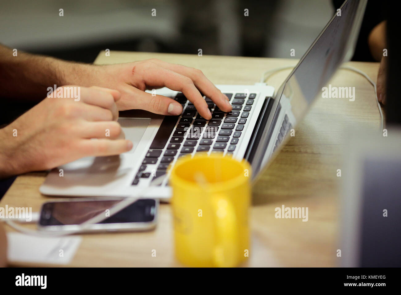 Man uses laptop for coding software Stock Photo - Alamy