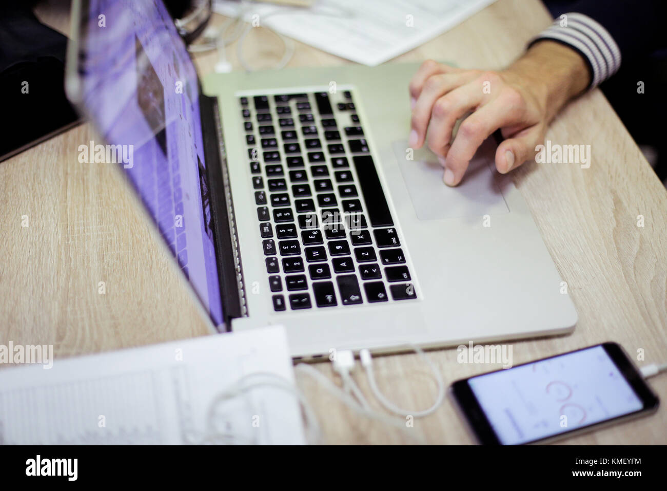 Man uses laptop for coding software Stock Photo - Alamy