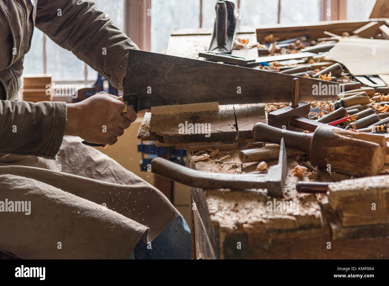 A man doing carpentry work at a workshop at Norbulingka Institute near ...