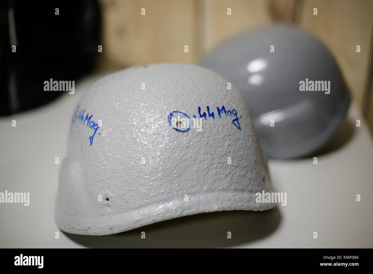 Military helmet with bullet marks Stock Photo - Alamy