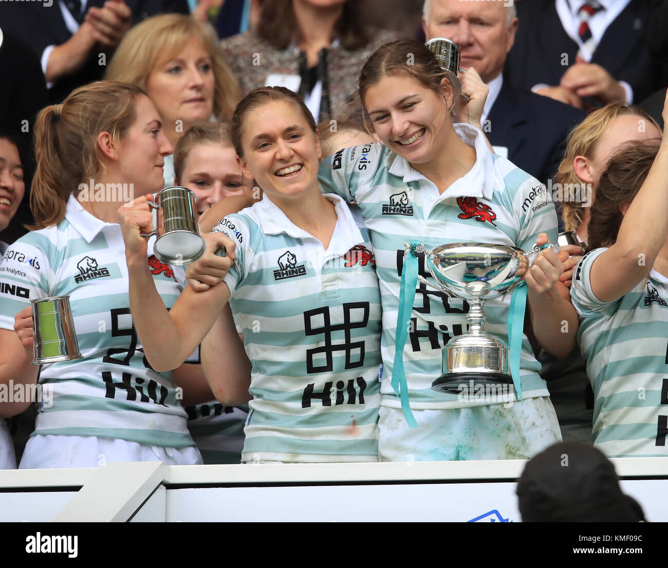 Cambridge women's captain Lara Gibson (right) lifts the winners cup ...