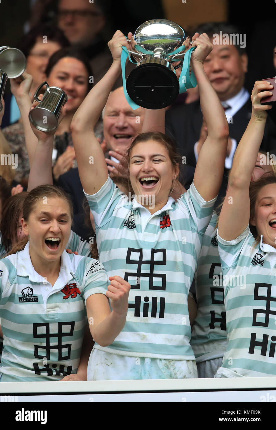 Cambridge women's captain Lara Gibson lifts the winners cup after the ...