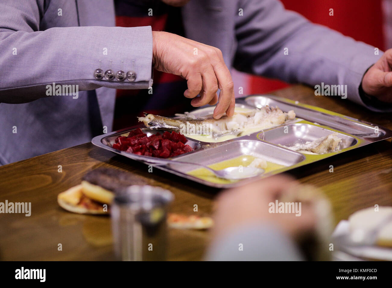 A person is having lunch at a cafeteria for poor people Stock Photo - Alamy