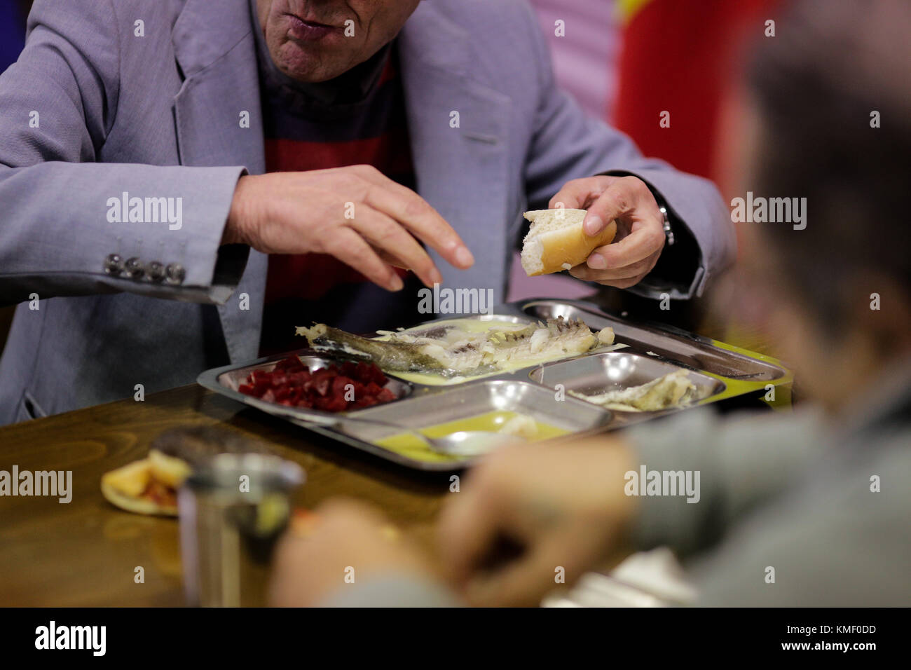 A person is having lunch at a cafeteria for poor people Stock Photo - Alamy