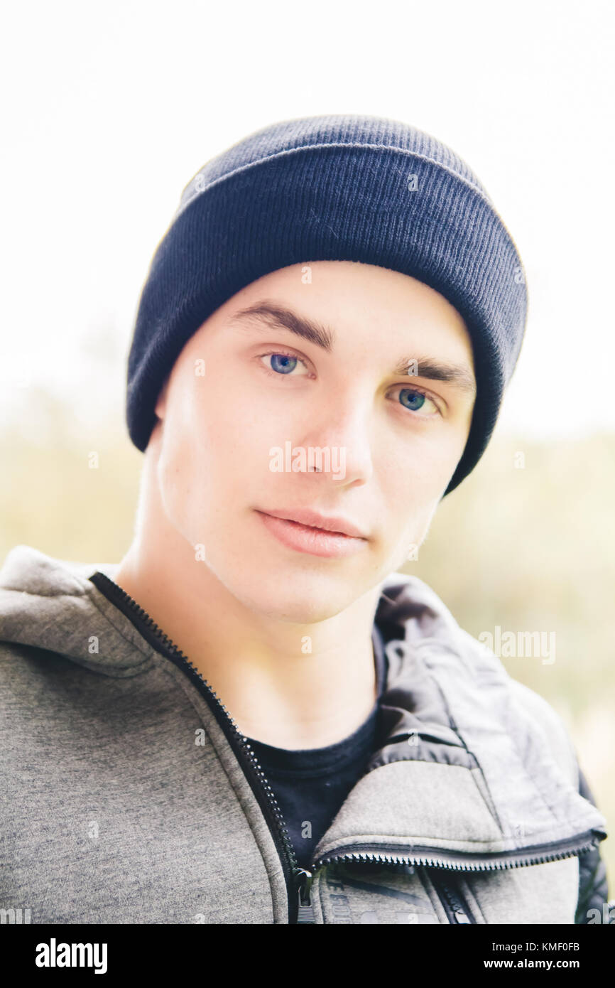 handsome young man posing for the camera Stock Photo - Alamy