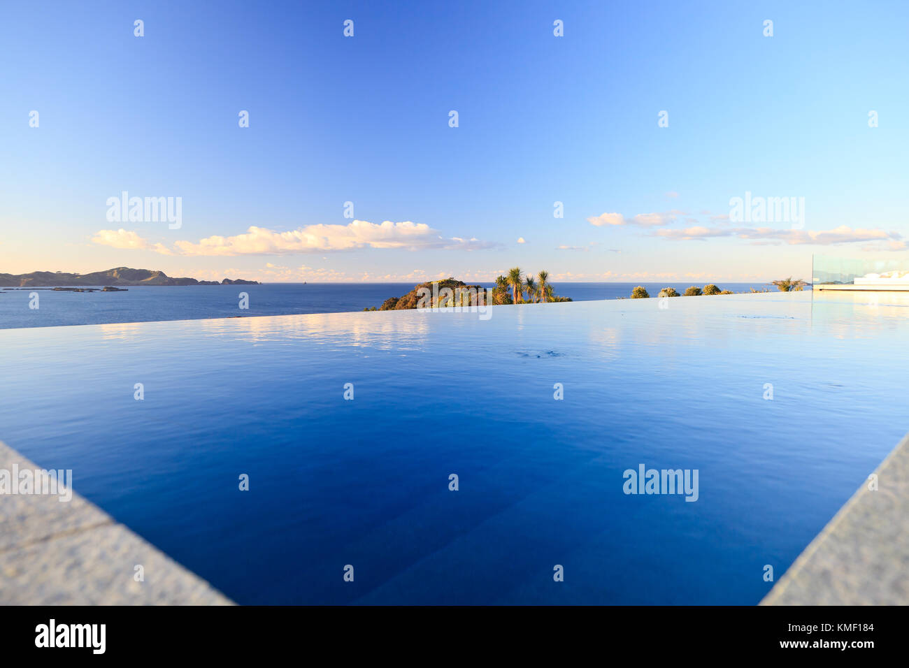 View over infinity pool out to sea Stock Photo - Alamy