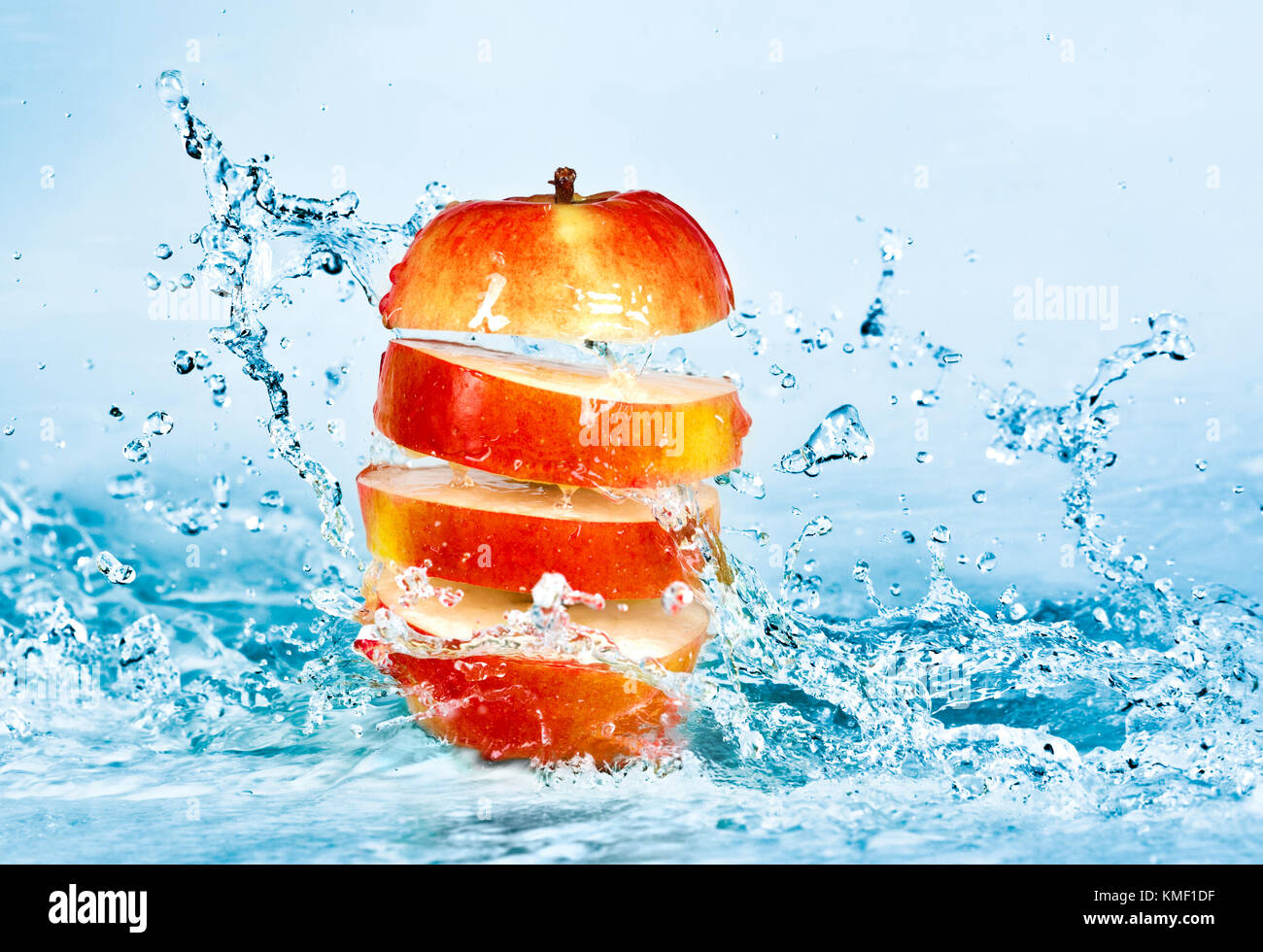 fresh water splash on red apple Stock Photo - Alamy