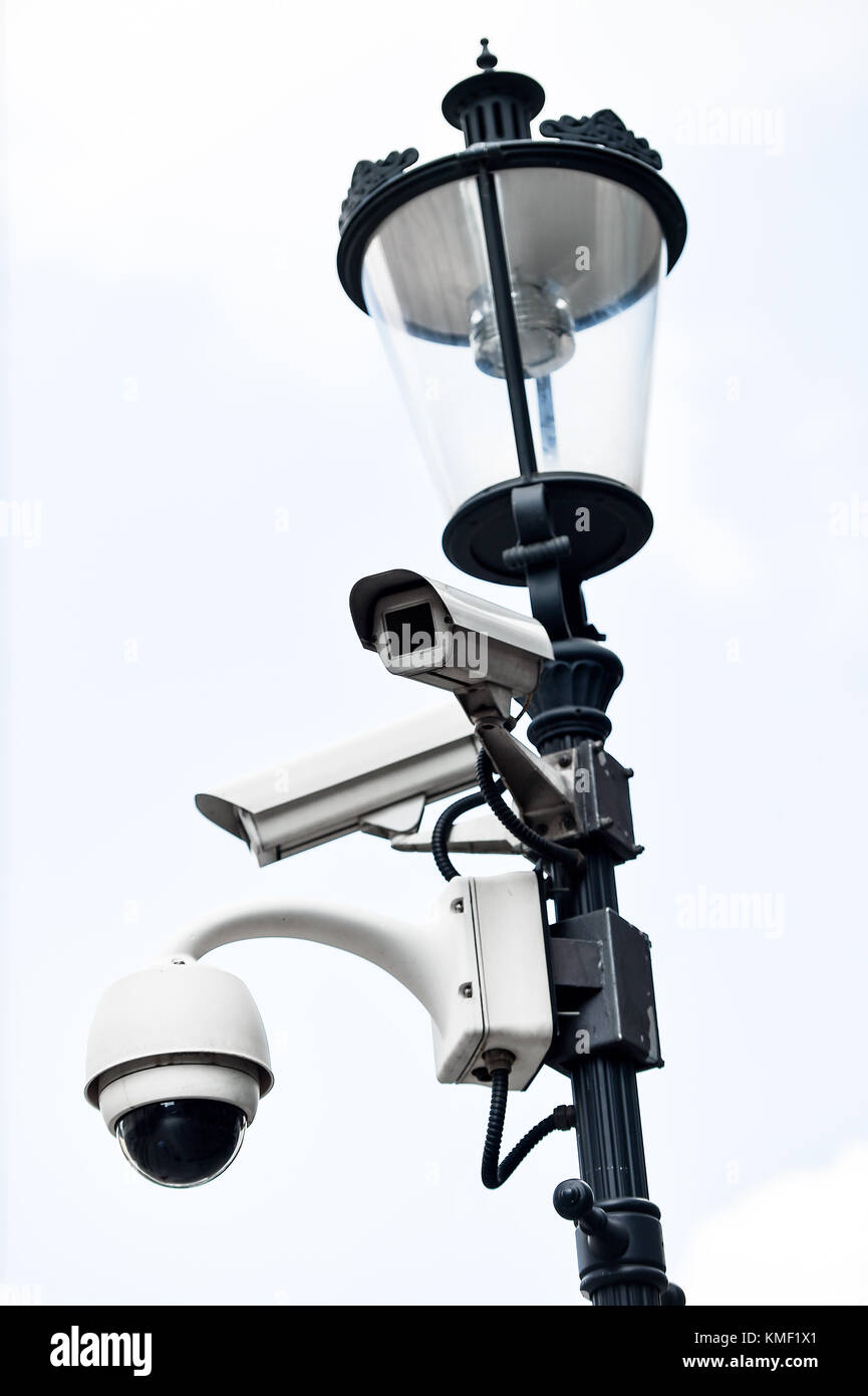Video surveillance camera on a lighting pole Stock Photo - Alamy