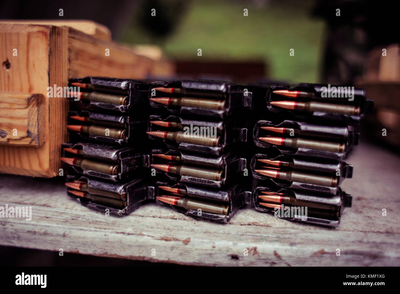 Automatic rifle cartridge with bullets on a military shooting range ...