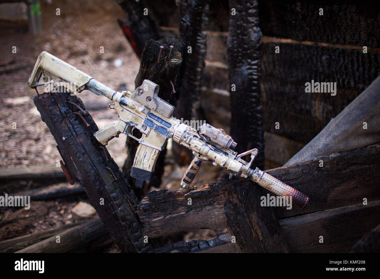 Assault Rifle, painted in sand color on the background of the burnt ...