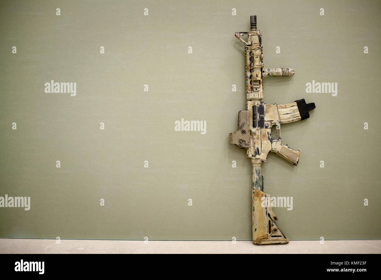 Assault Rifle, painted in sand color on a green background. Airsoft ...