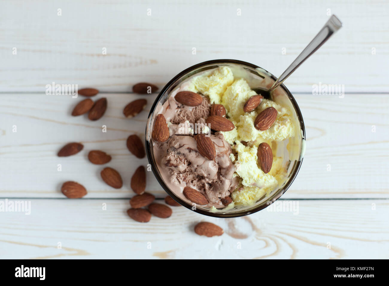 Melon and Chocolate ice cream with almonds in the background waffle ...