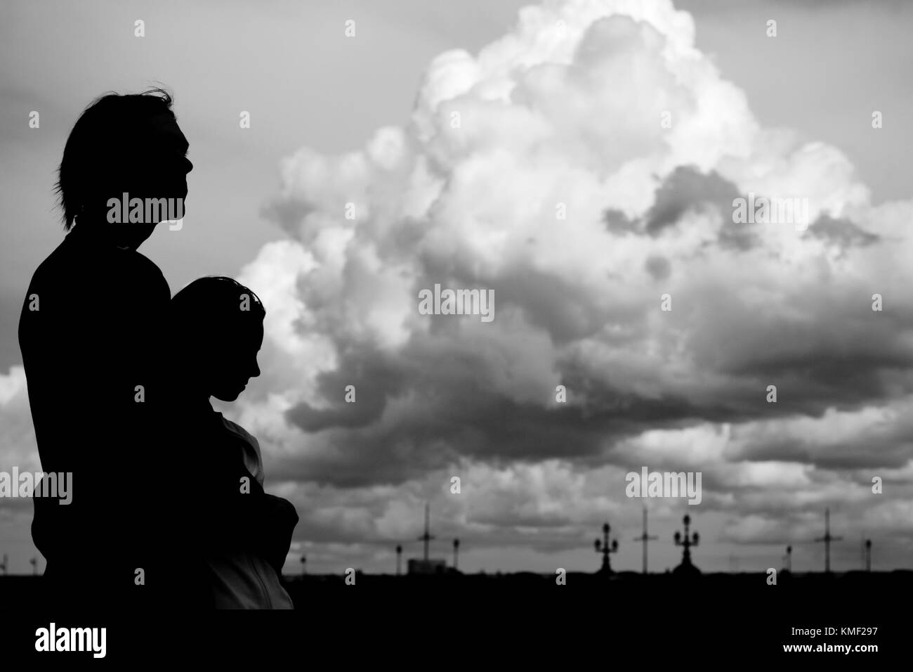 Back view of man and woman huging together on the bridge on the ...