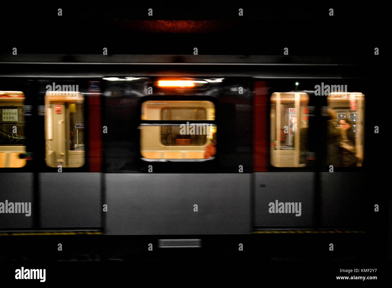 Moving train at night - subway line Stock Photo - Alamy