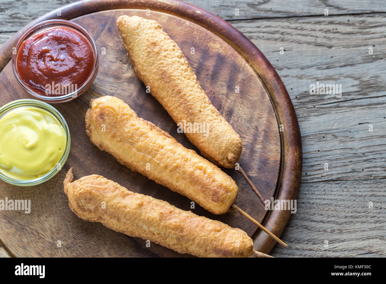 Stack of corn dogs on the wooden board Stock Photo - Alamy