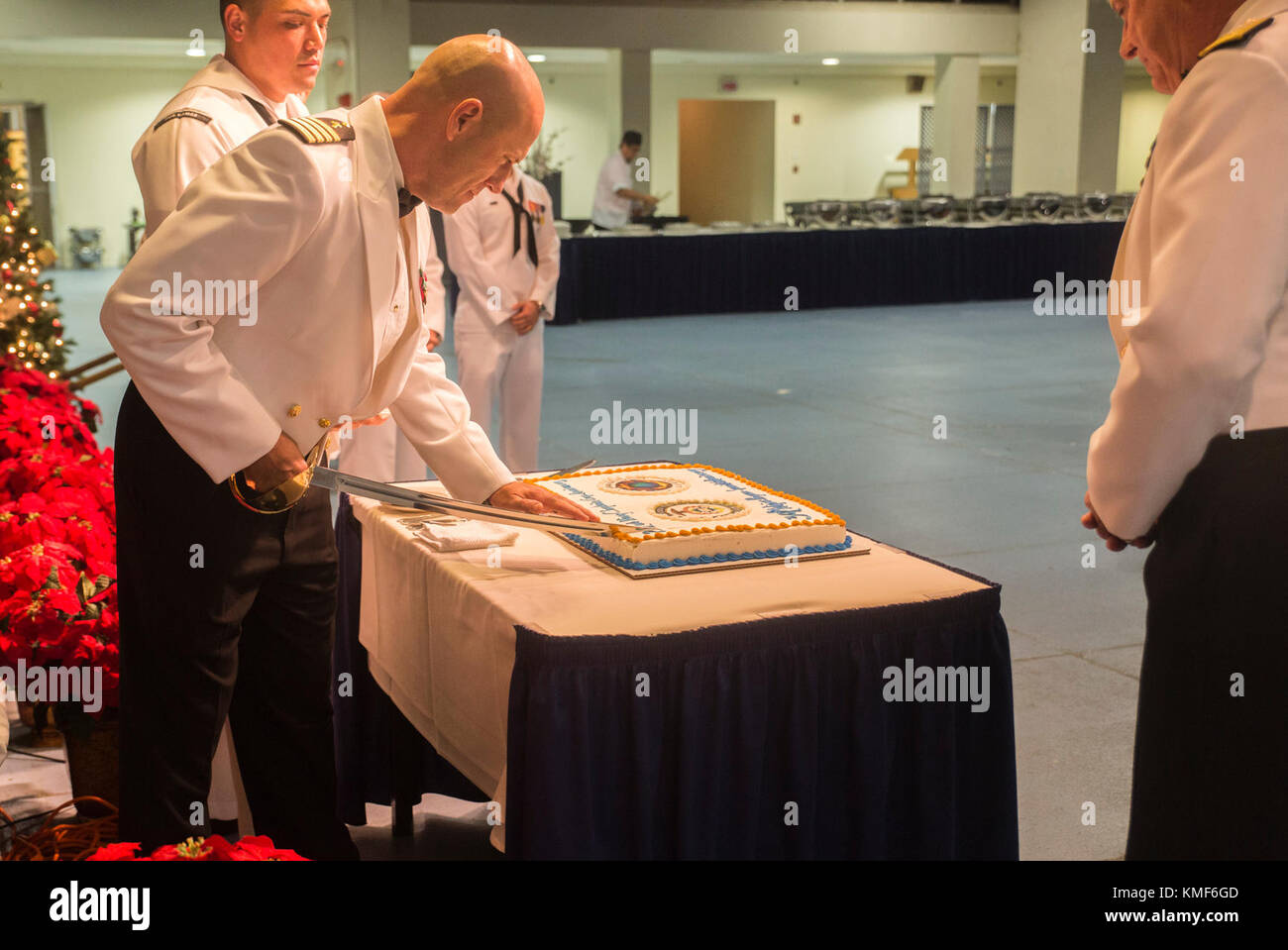 U.S. Navy Capt. Stephen Lee cuts the ceremonial birthday cake during ...