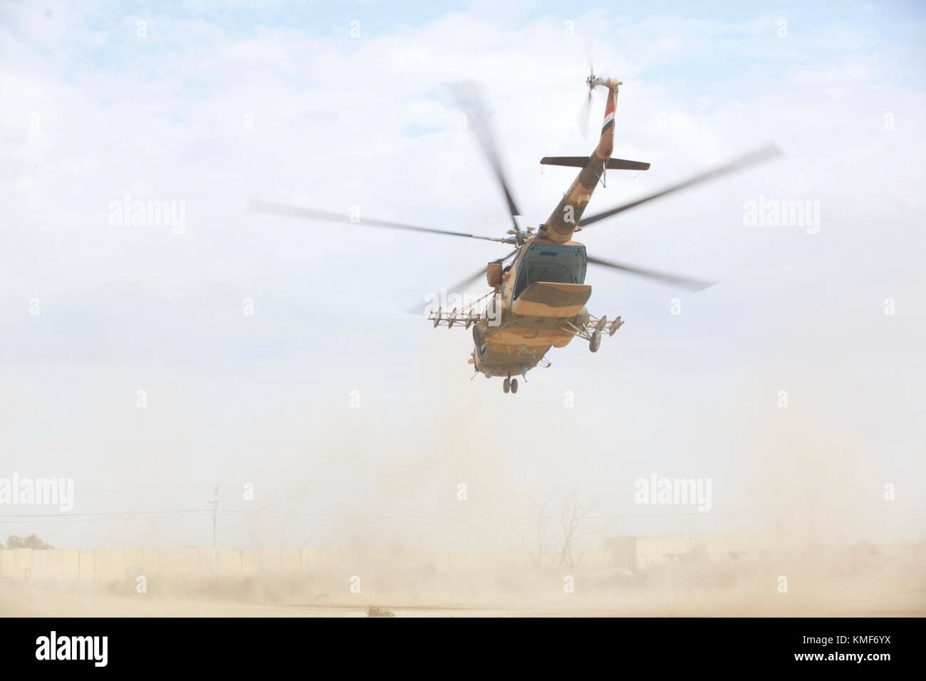 An Iraqi Army Mi-17 helicopter takes off after carrying members of the ...
