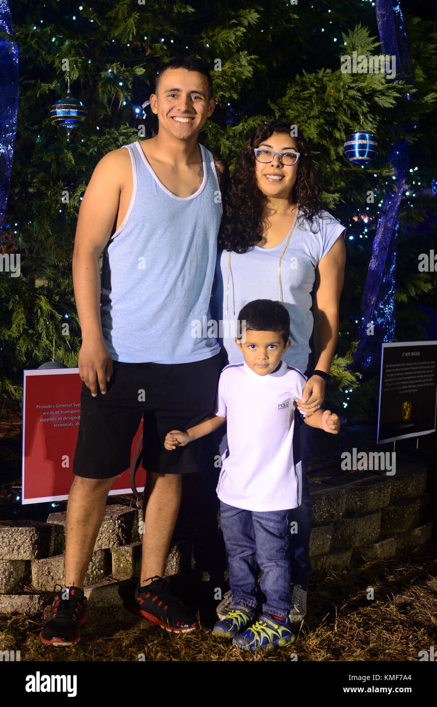 The Quintero family from the 3rd Infantry Division enjoy the tree ...
